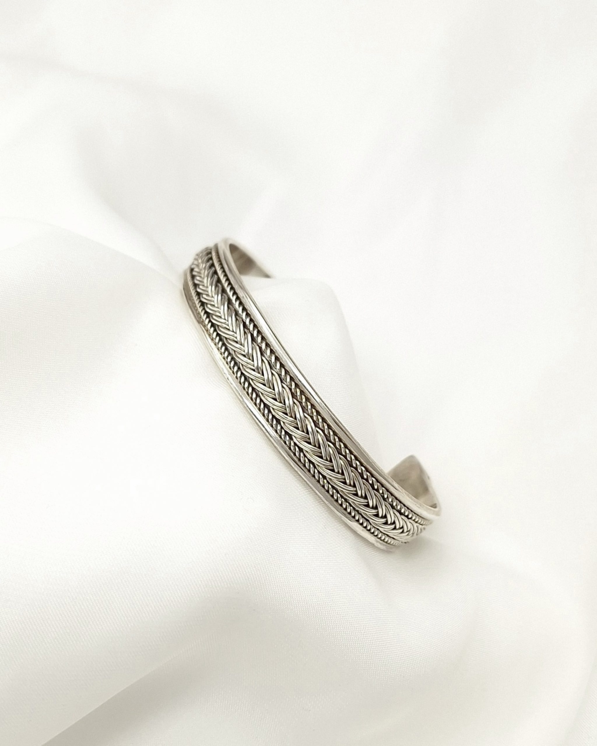 Handcrafted sterling silver cuff bracelet with braided design